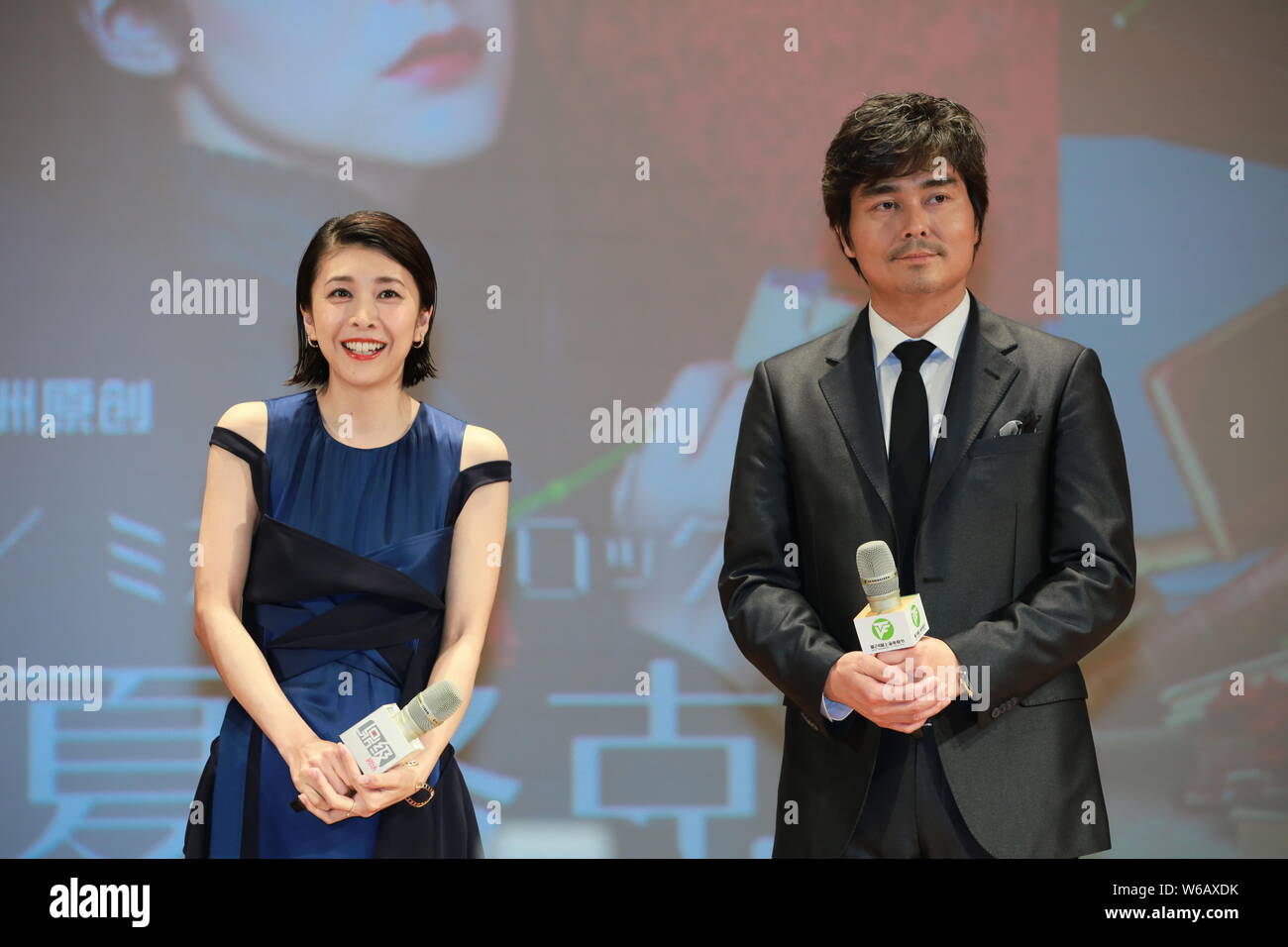 Japanese actress Yuko Takeuchi, left, and actor Yukiyoshi Ozawa attend ...
