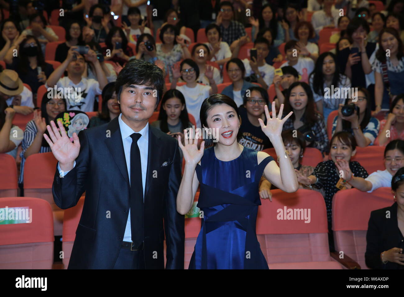 Japanese actress Yuko Takeuchi, right, and actor Yukiyoshi Ozawa pose ...