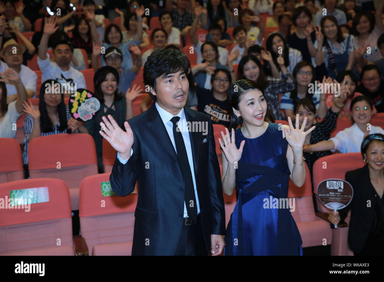 Japanese actress Yuko Takeuchi, right, and actor Yukiyoshi Ozawa pose ...