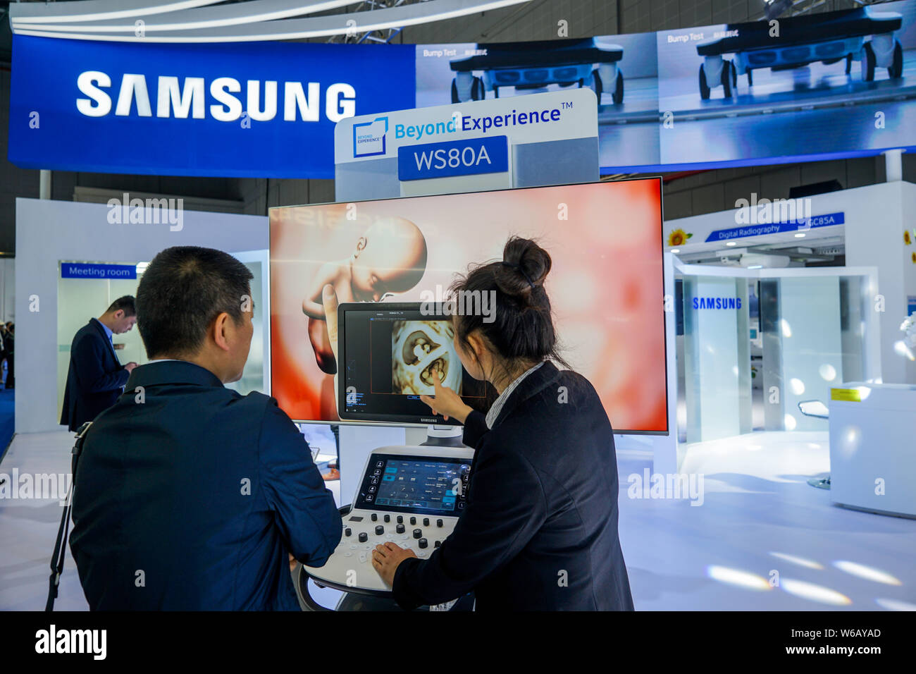 --FILE--People visit the stand of Samsung during the 22nd China ...
