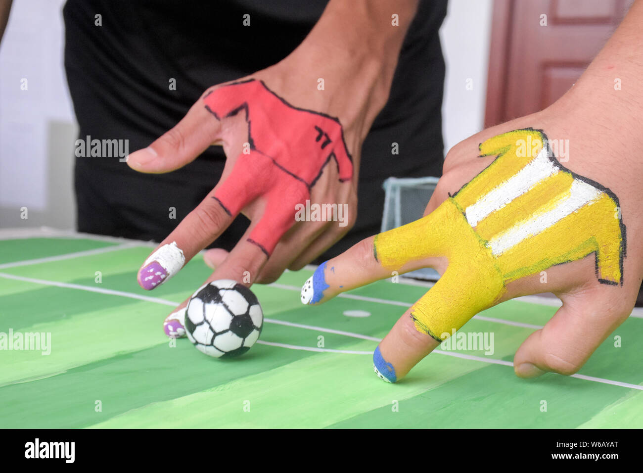 Students play the finger football game at the Liaocheng University in ...