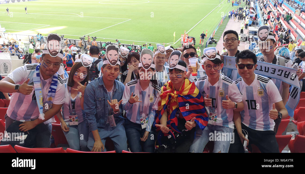 Chinese football fans of Lionel Messi, Argentina, pose for photos in a ...