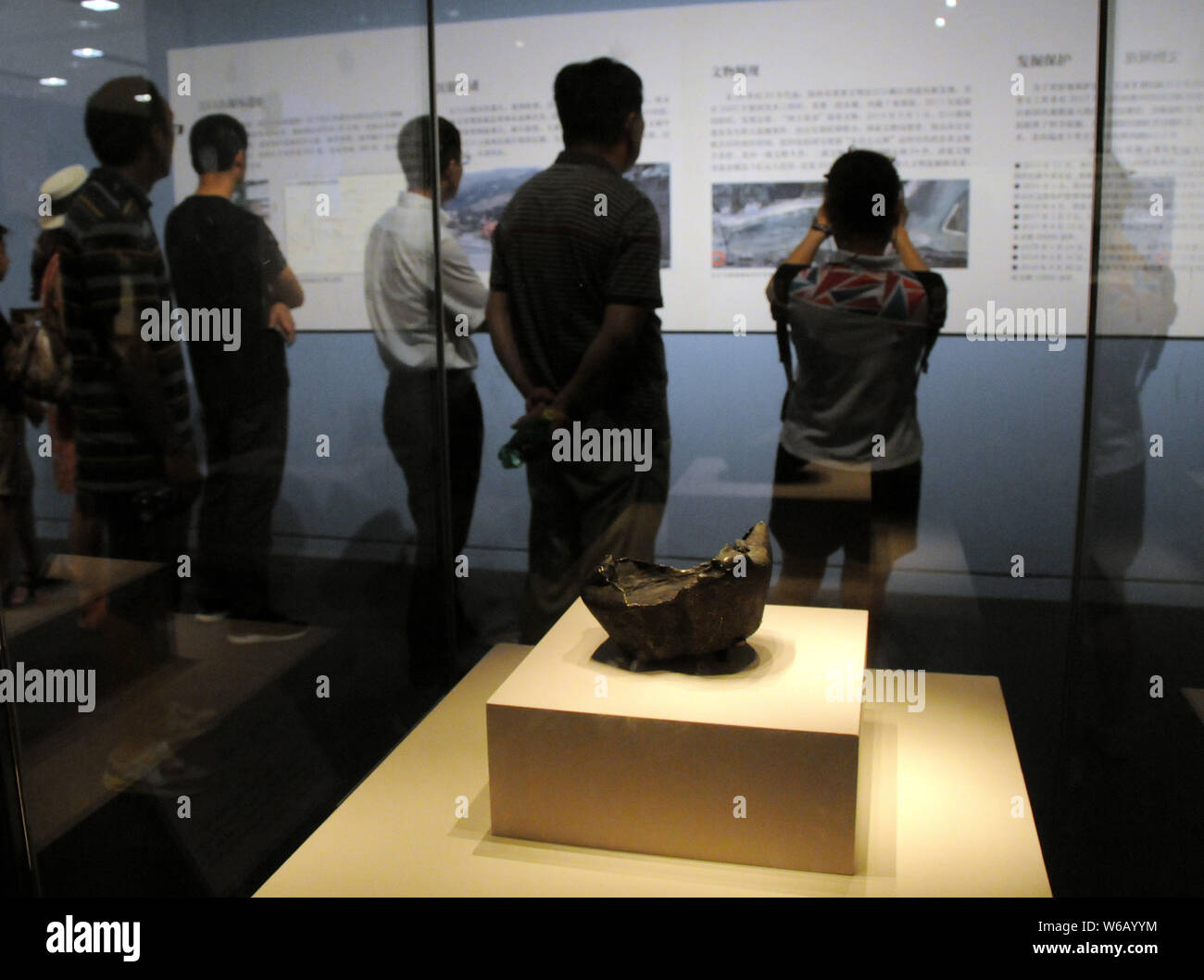 A silver ingot unearthed from the sunken boats owned by peasant leader ...