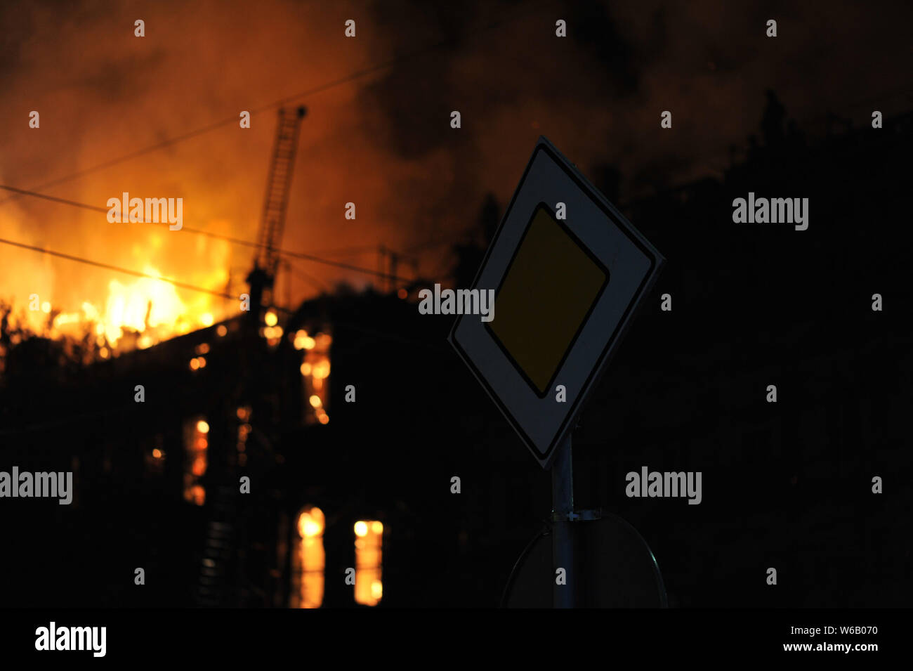 Big fire at night. Old building burns at night Stock Photo - Alamy