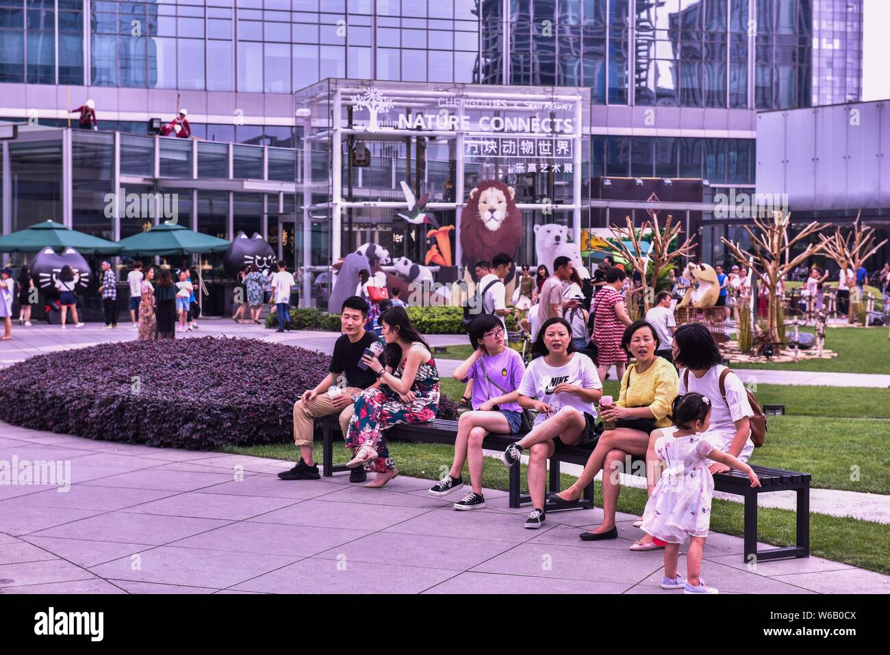 Visitors look at Lego sculptures created by New York-based artist Sean ...