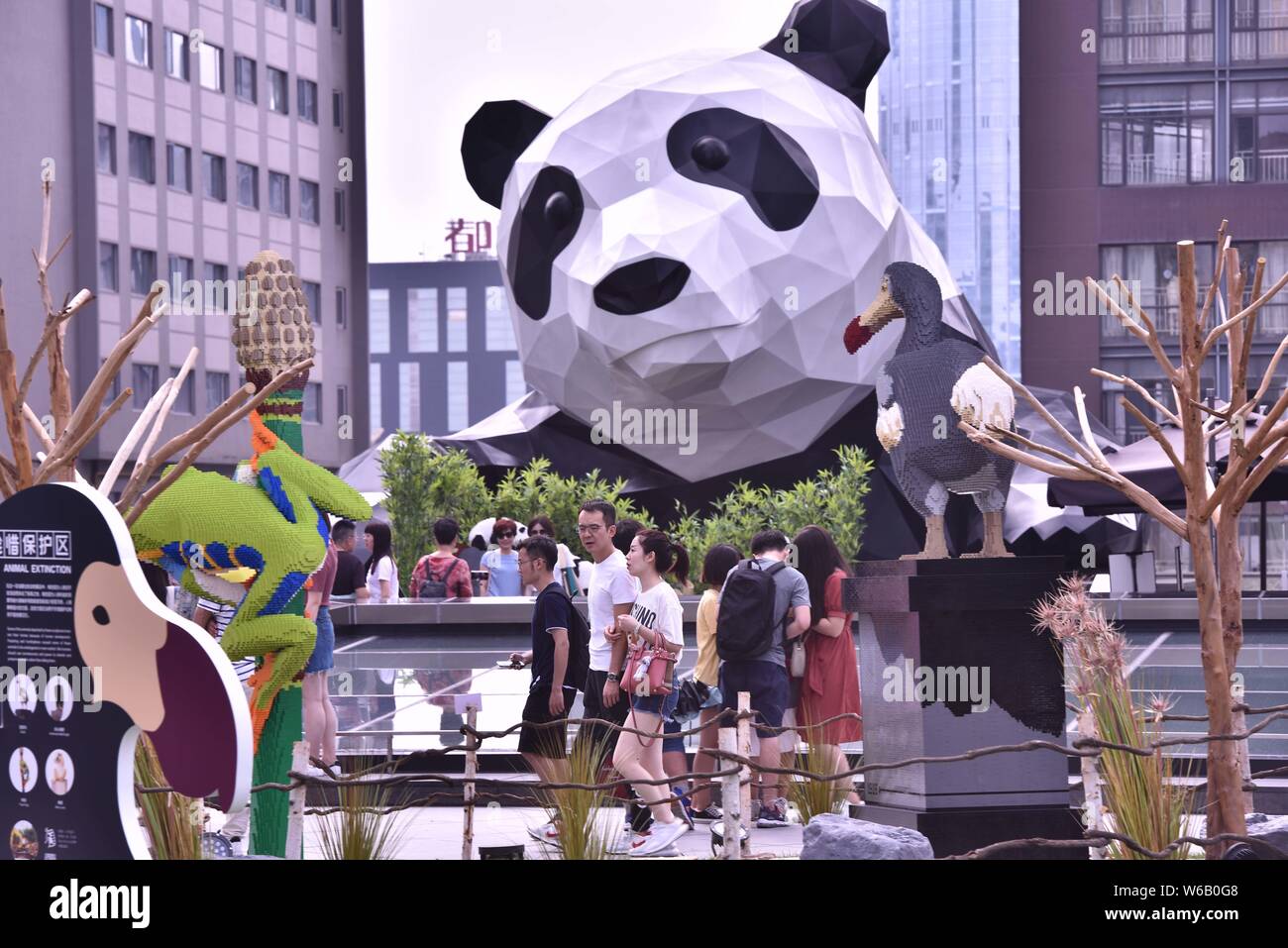 Visitors look at Lego sculptures created by New York-based artist Sean ...