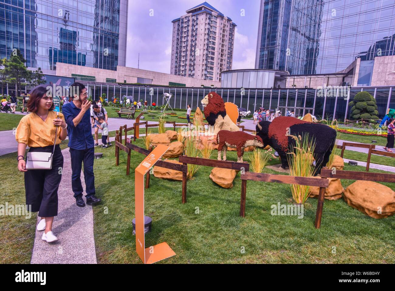 Visitors look at Lego sculptures created by New York-based artist Sean ...