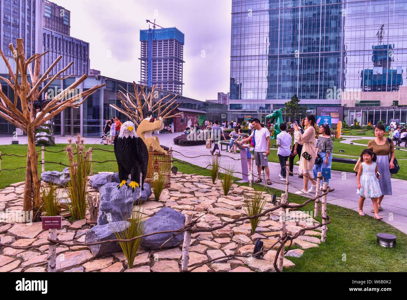 Visitors look at Lego sculptures created by New York-based artist Sean ...