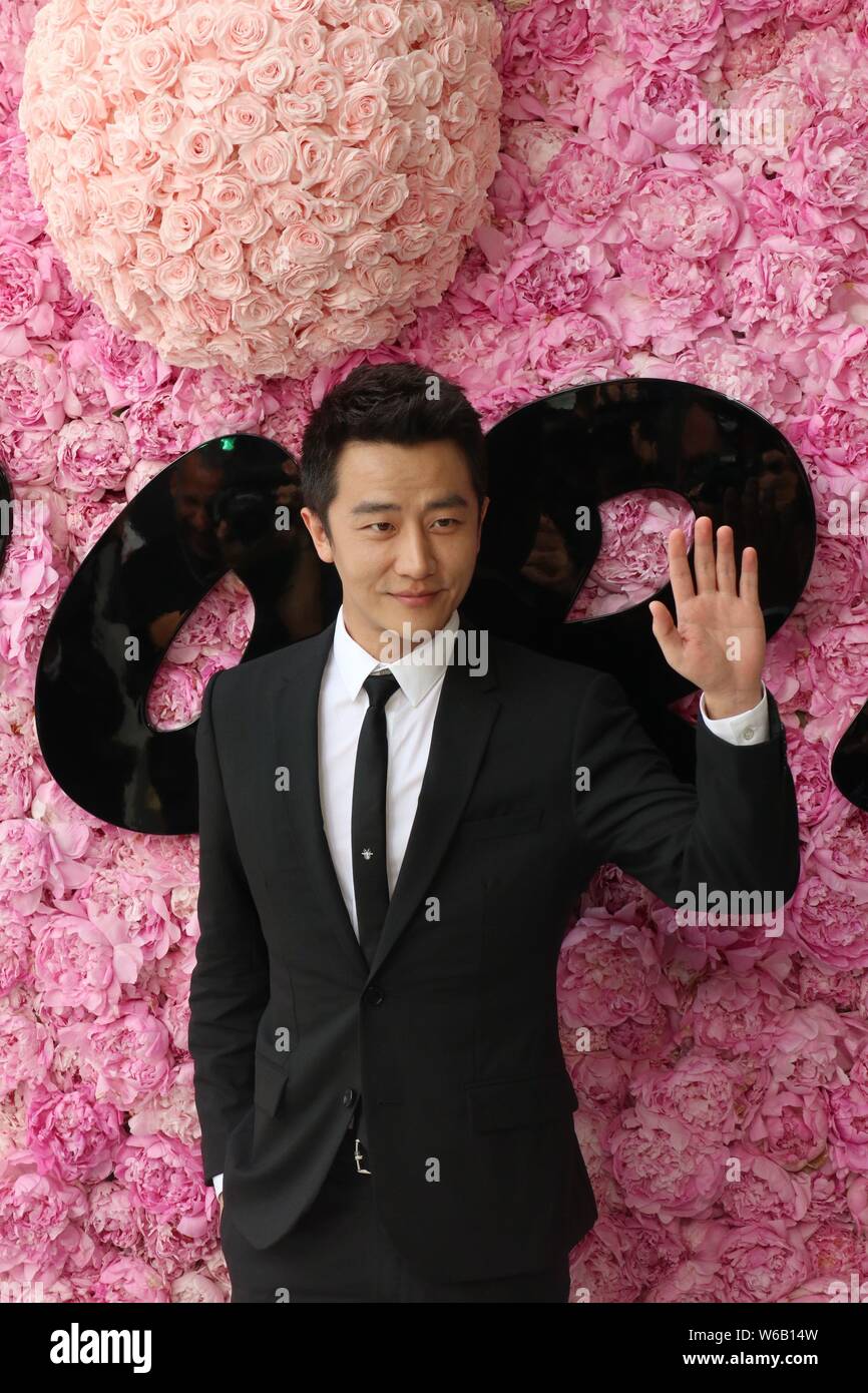 Chinese actor Huang Xuan attends the fashion show of Dior Homme during ...
