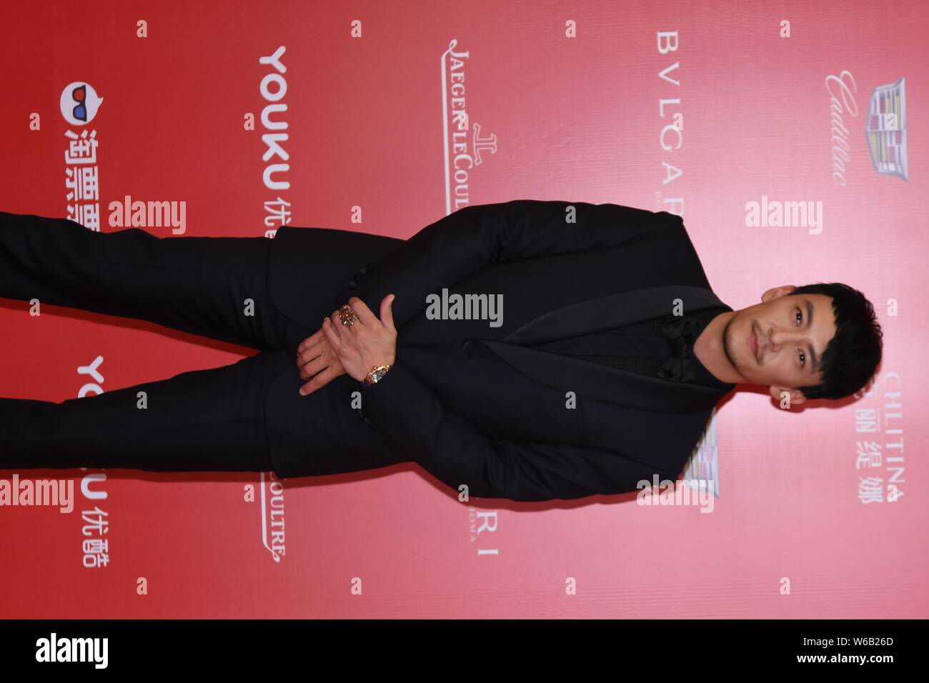 Taiwanese actor Zhang Zhen poses as he arrives on the red carpet for ...
