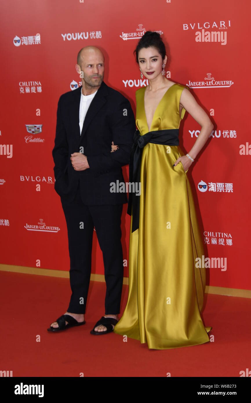 English actor Jason Statham, left, and Chinese actress Li Bingbing pose ...