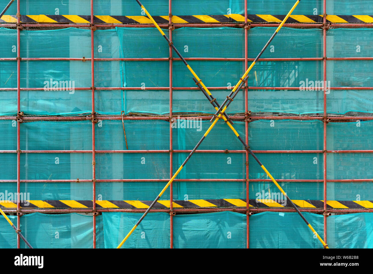 scaffolding and protection netting on an unfinished building Stock ...