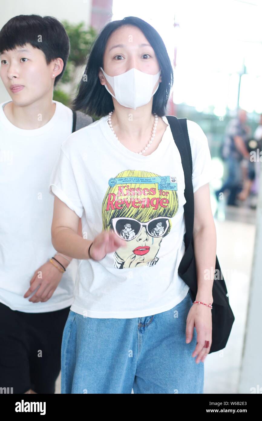 Chinese actress Zhou Xun arrives at the Beijing Capital International Airport in Beijing, China ...