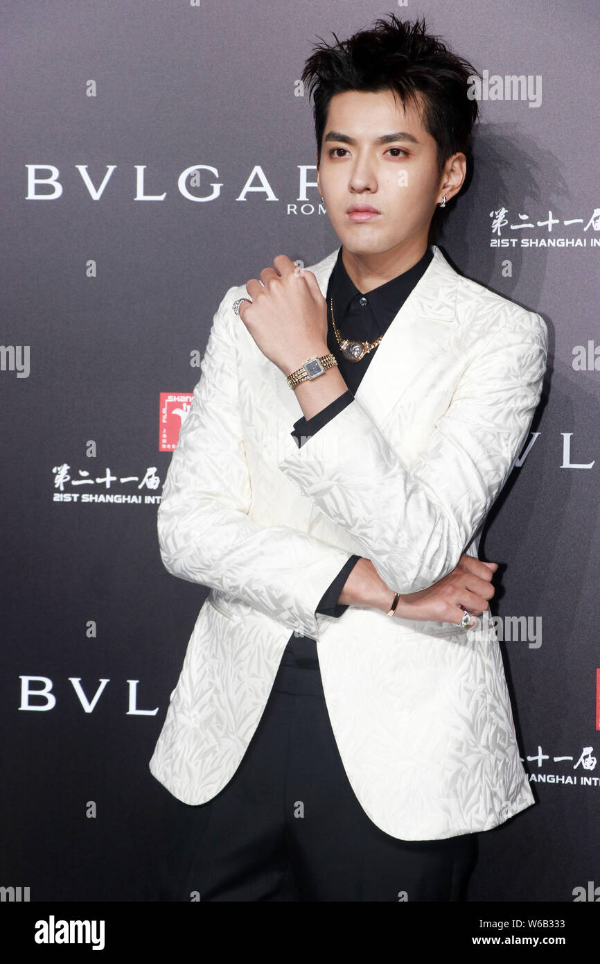 Chinese singer and actor Kris Wu or Wu Yifan, center, attends a launch ...
