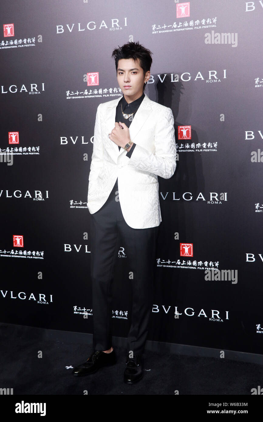 Chinese singer and actor Kris Wu or Wu Yifan, center, attends a launch ...