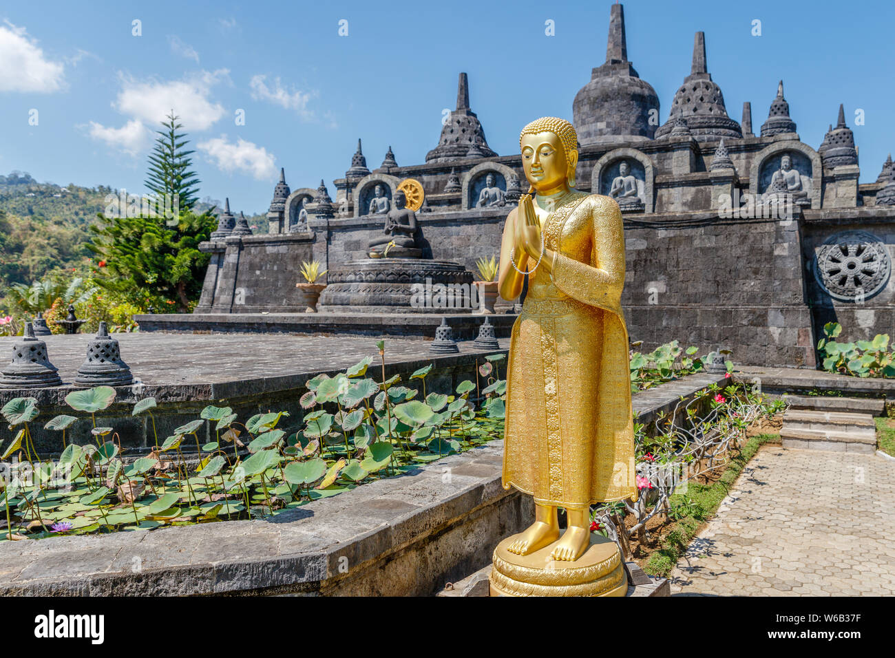 Statue of Buddha and miniature Borobudur at Brahmavihara Arama (Vihara ...