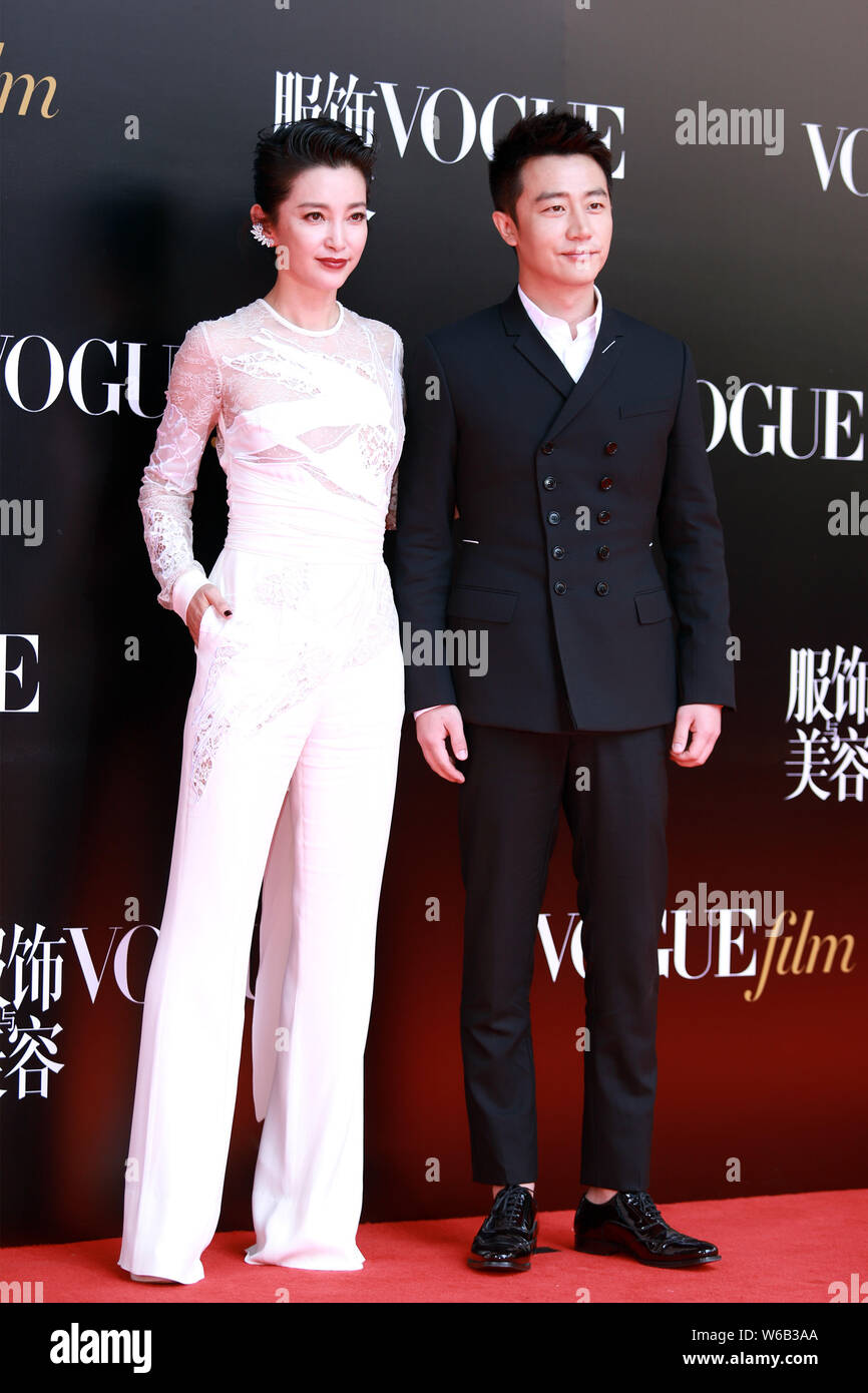 Chinese actress Li Bingbing, left, and actor Huang Xuan pose as they ...