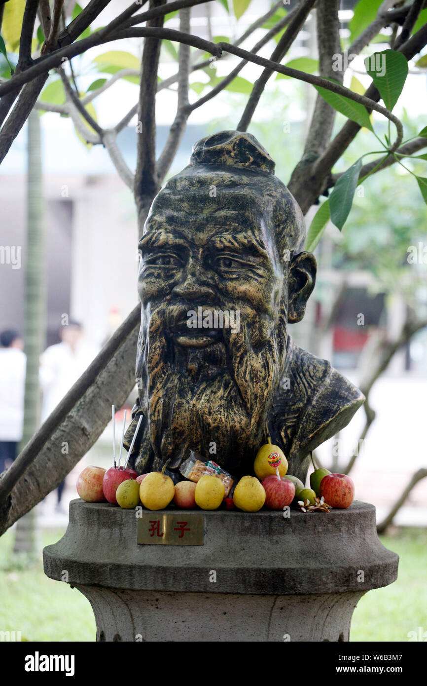A bronze statue of Chinese ancient teacher and philosopher Confucius is ...