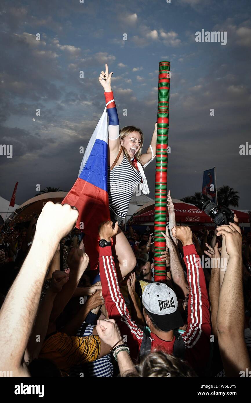 Football fans from the whole world build a human tower in order to ...