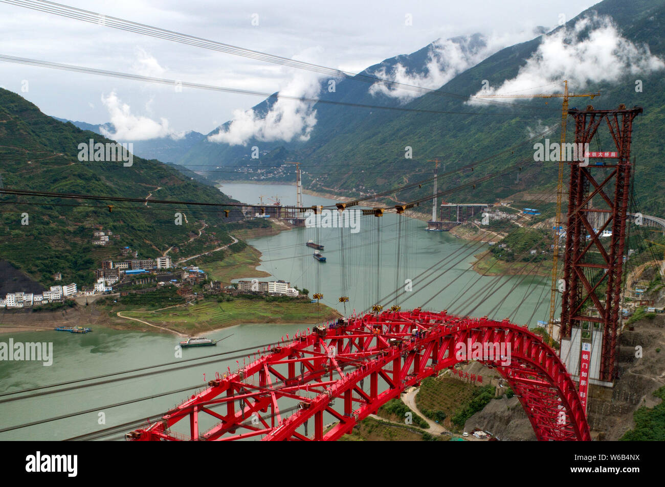 Aerial view of the closure of main arch of the Xiangxi Yangtze River ...