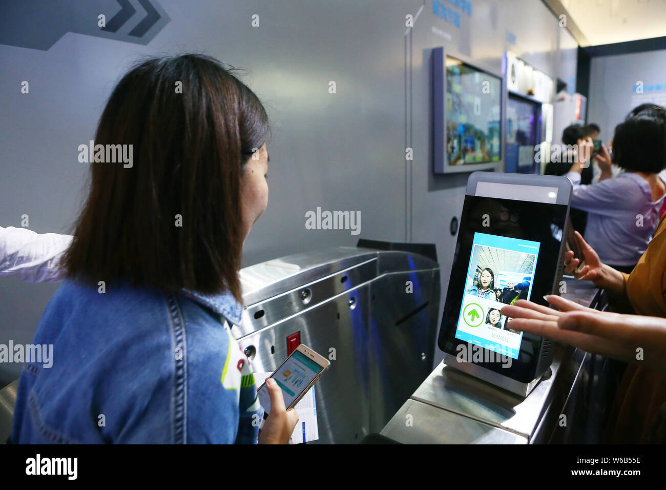 A visitor tries out a facial recognition system that can allow ...