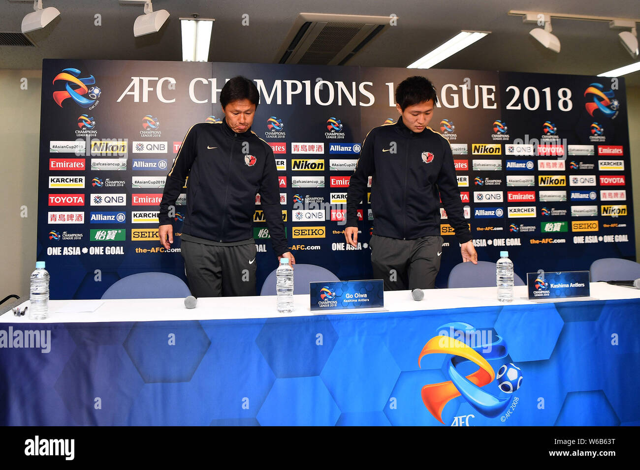 Head coach Go Oiwa, left, and Japanese football player Kento Misao of ...