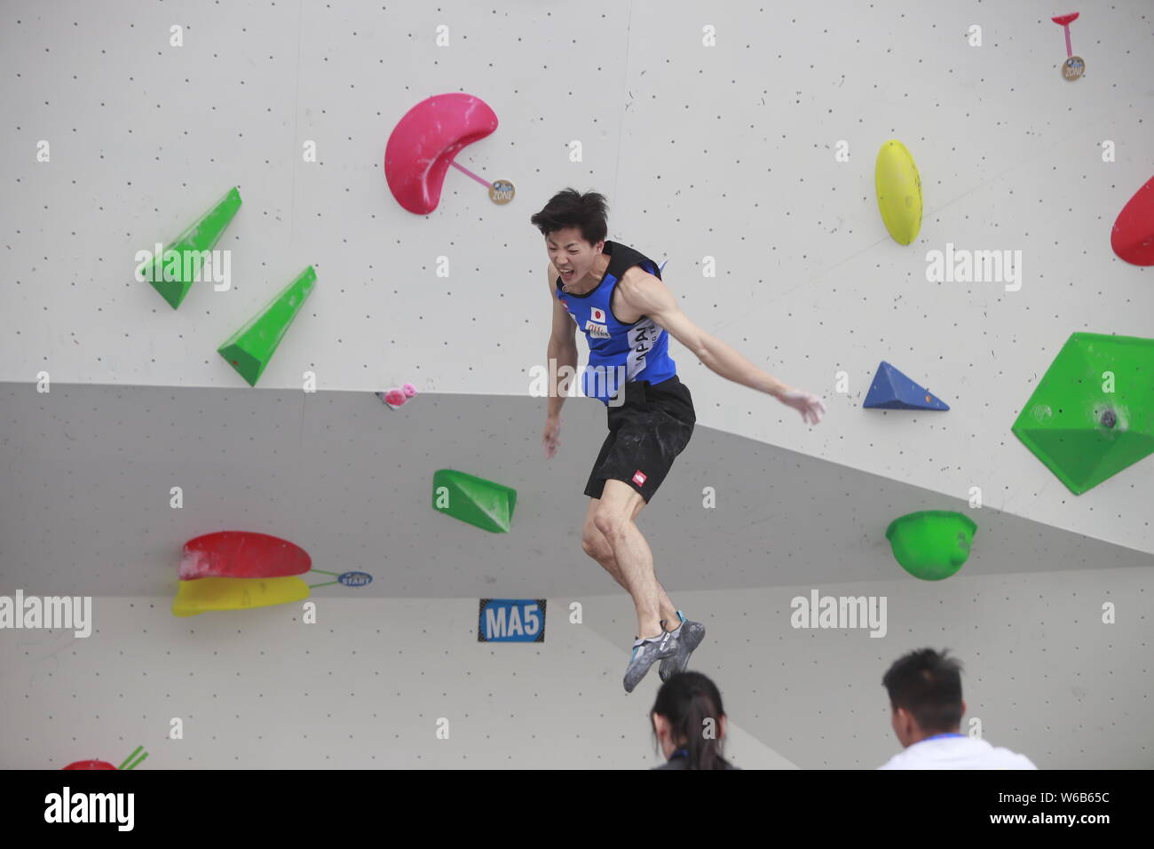Kokoro Fujii of Japan competes in the men's qualification bouldering ...