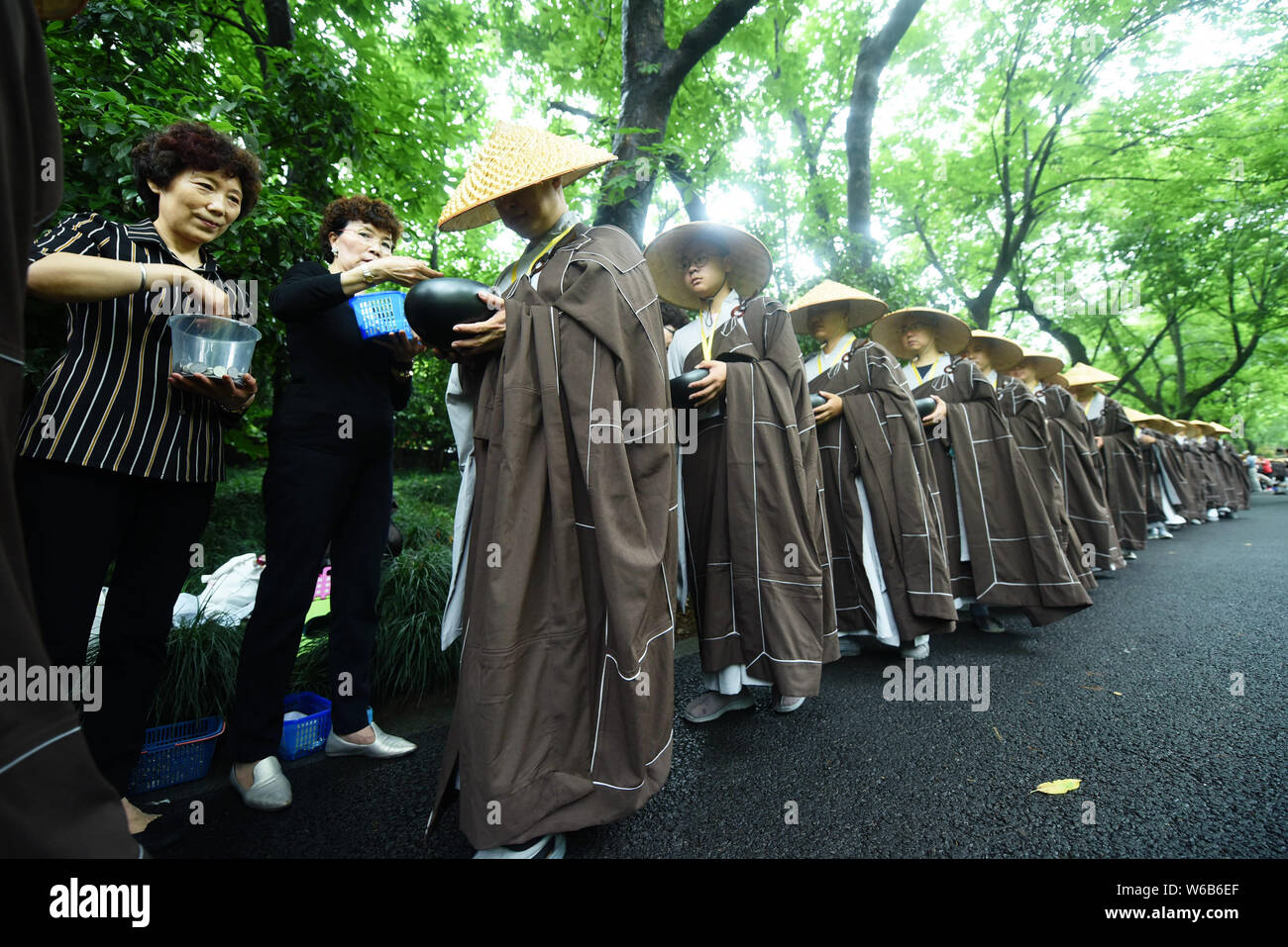 Buddhist monks holding alms bowls hi-res stock photography and images ...