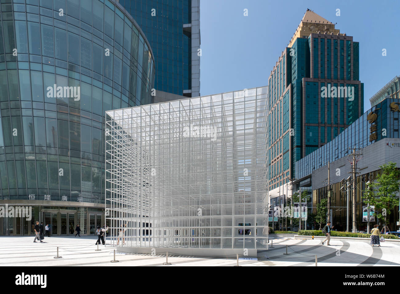 View of a white cube installation with 22 SLR cameras inside on a ...