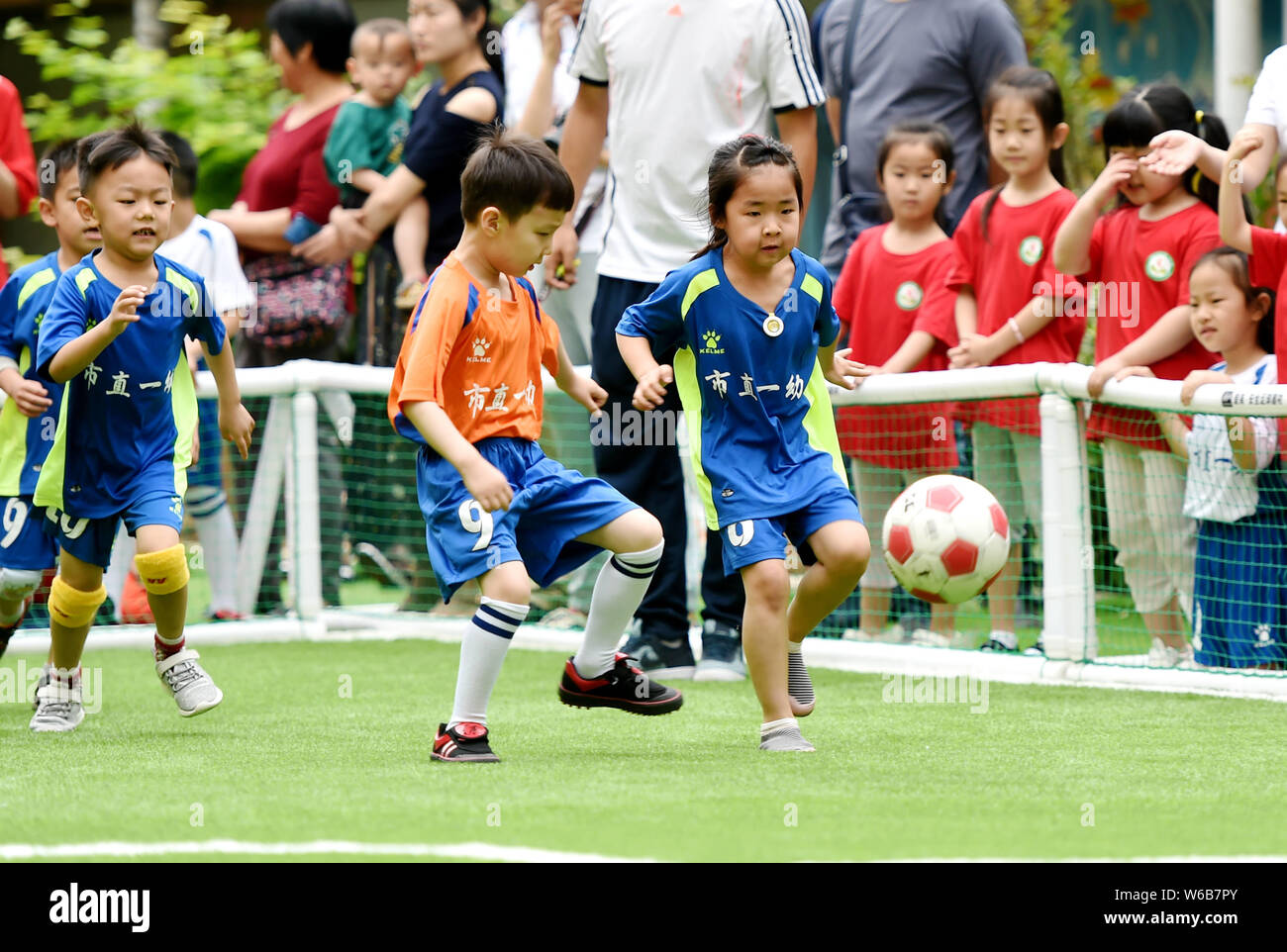 Chinese children take part in a football contest at a kindergarten in ...