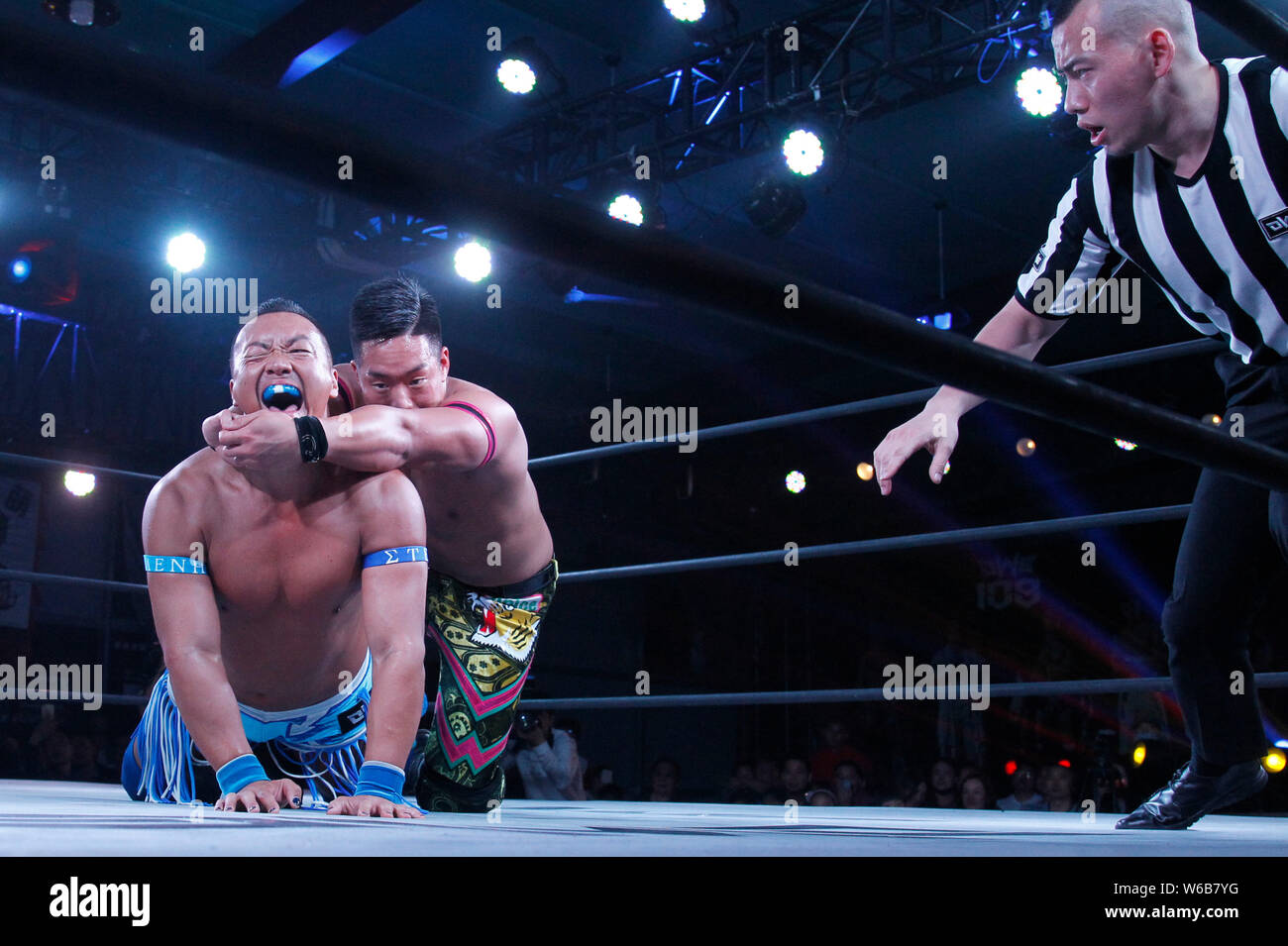 Foreign wrestlers compete against each other in a performance during ...