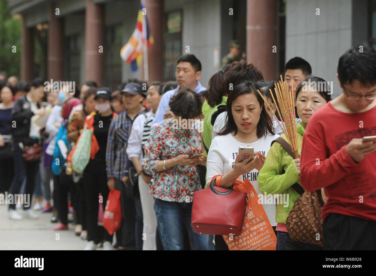 Queue in temple hi-res stock photography and images - Alamy