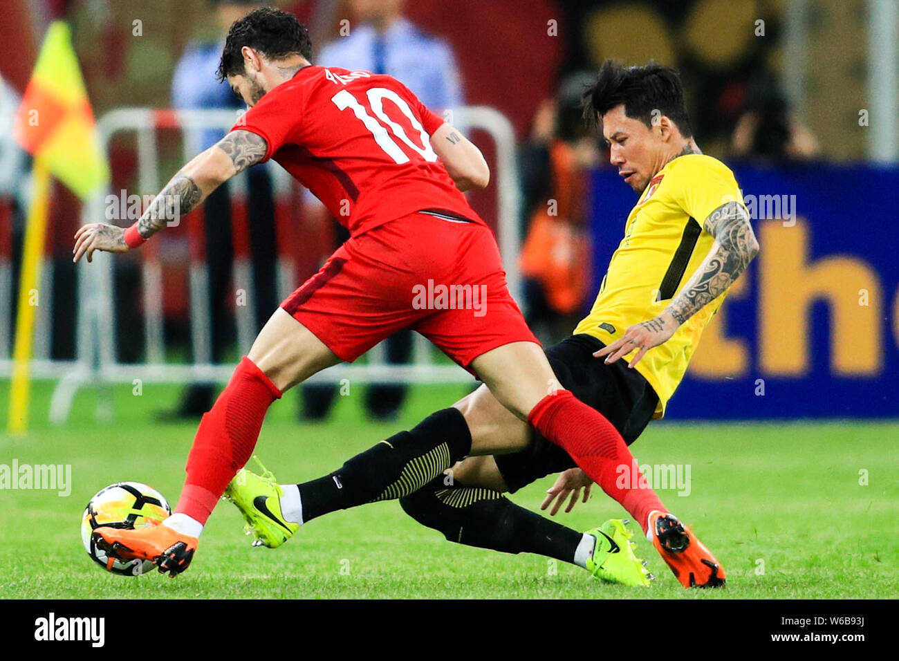 Zhang Linpeng, right, of China's Guangzhou Evergrande Taobao challenges ...