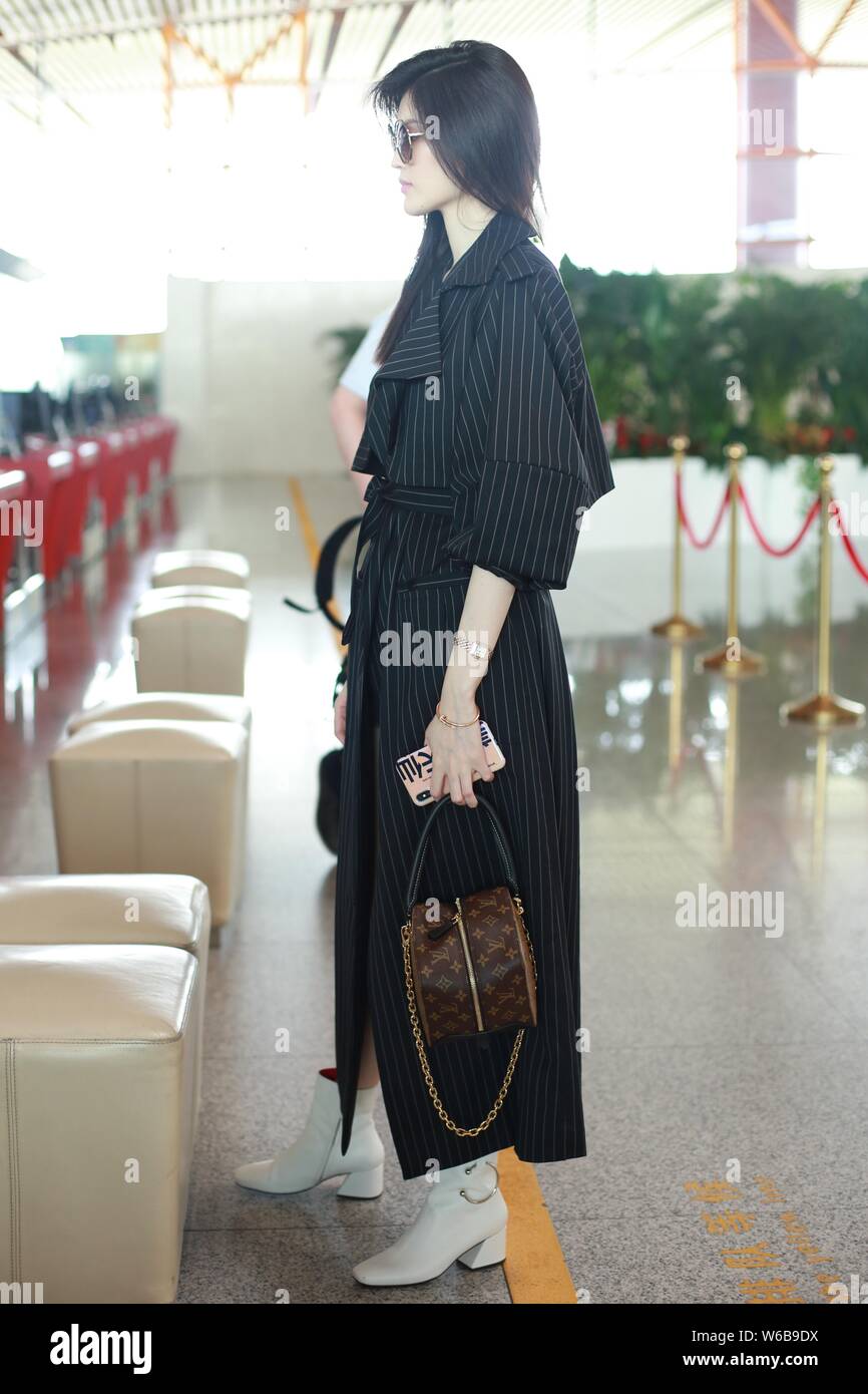 Chinese model He Sui is pictured as she arrives at the Beijing Capital ...