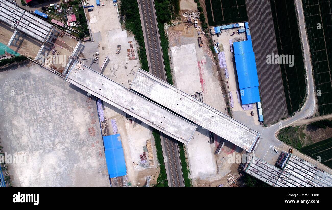 Two girder bridges weighing 10,400 tonnes are rotated 52.5 degrees ...