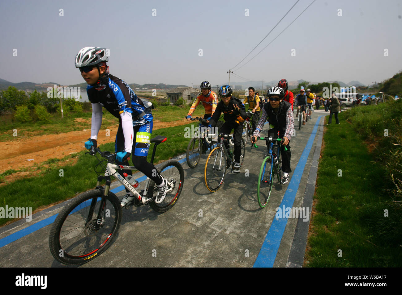 --FILE--Chinese cyclists ride on a bicycle freeway in Ningbo city, east ...
