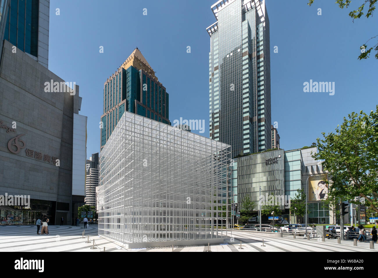View of a white cube installation with 22 SLR cameras inside on a ...