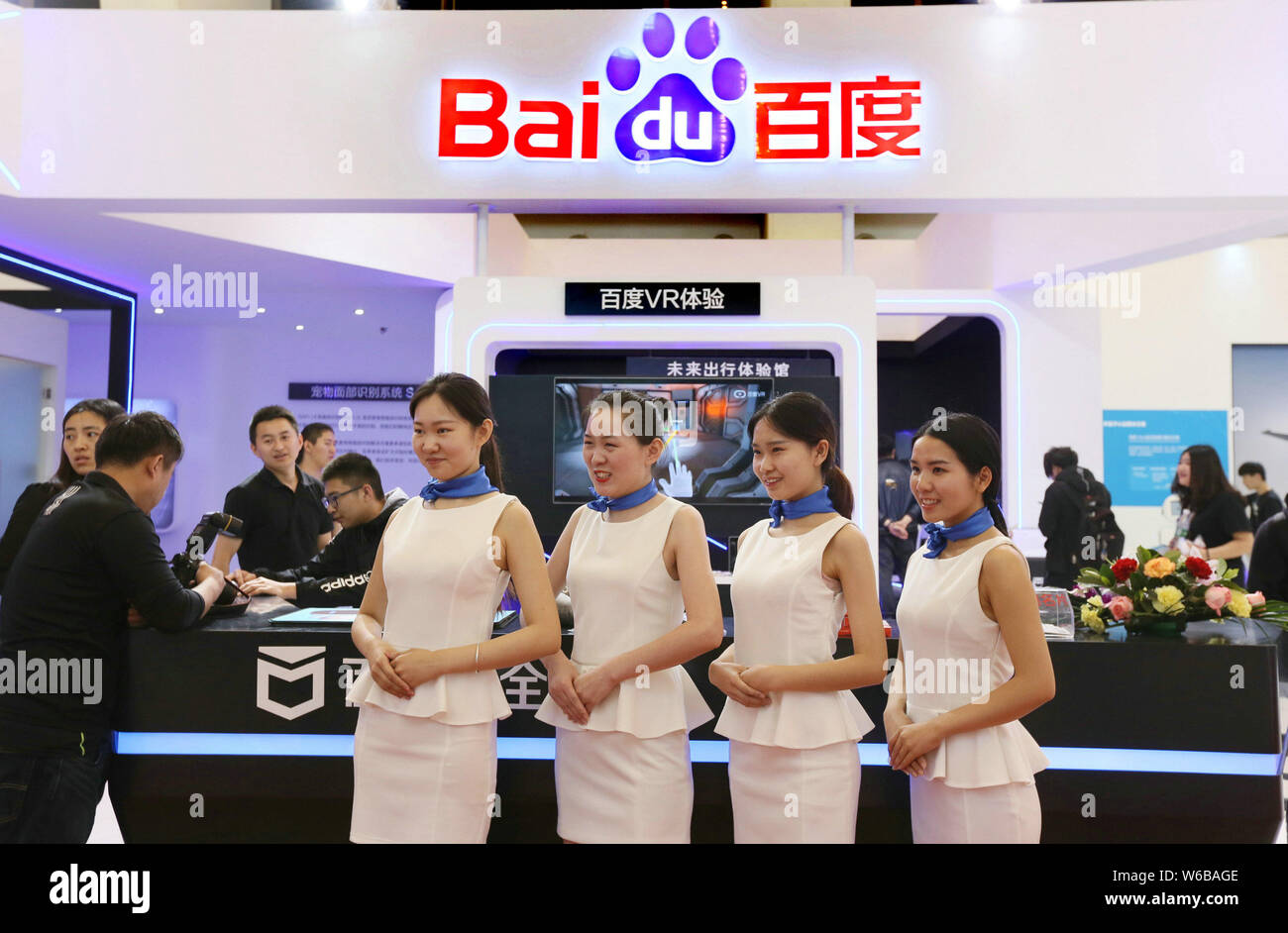 --FILE--Chinese models pose at the stand of Chinese search engine ...