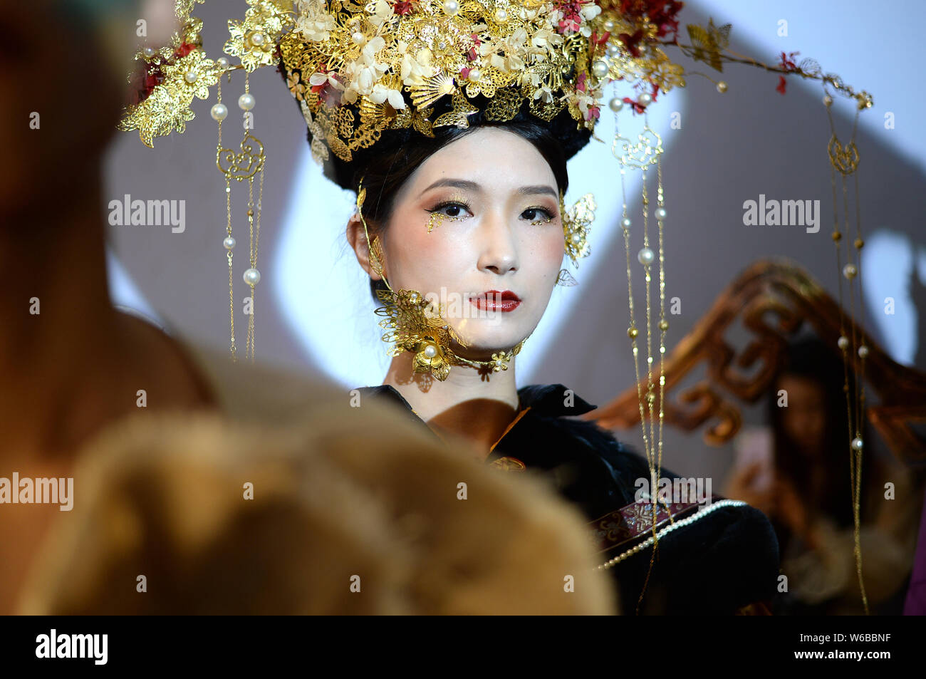 A model displays a creation by a graduate during a fashion show for ...
