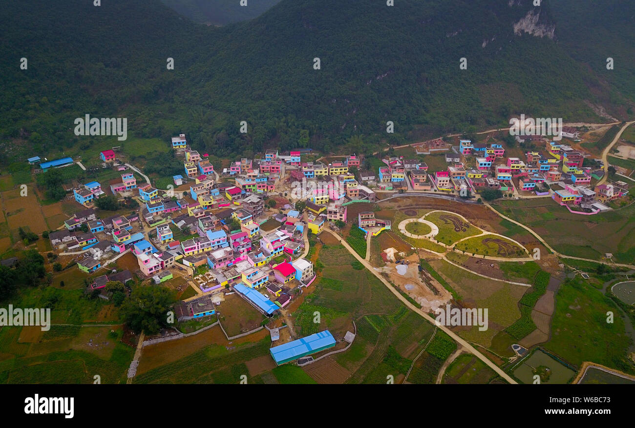 View of the colorful fairy tale houses of the village in Liuzhou city ...