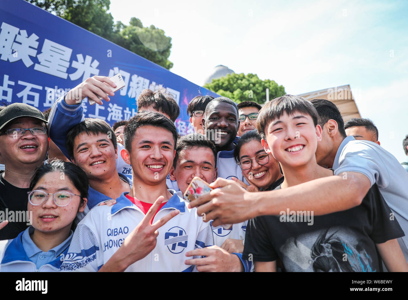 American sprinter Justin Gatlin poses for selfies with students at the ...