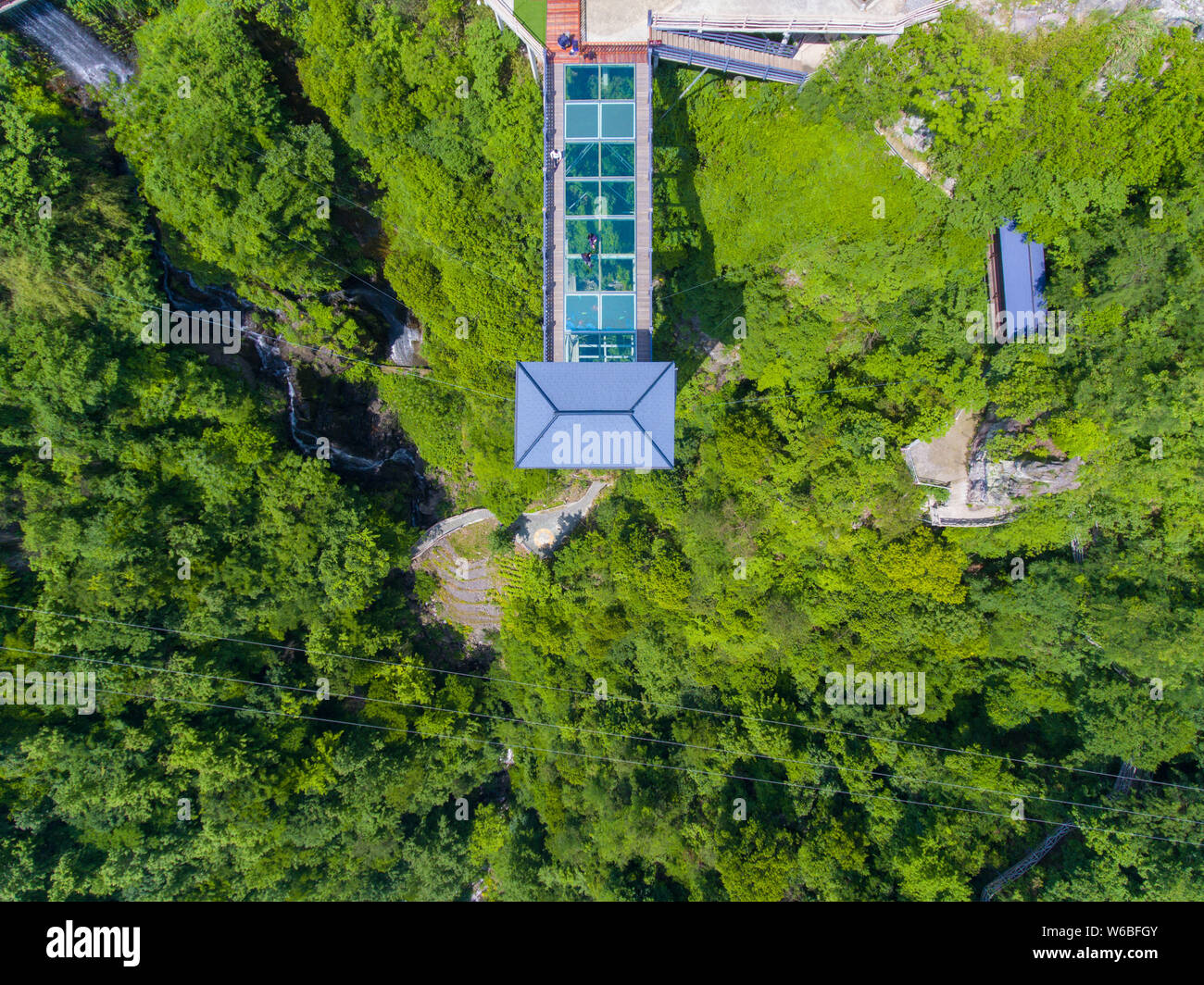 Aerial view of the 5D glass bridge at a scenic spot in Pan'an county ...