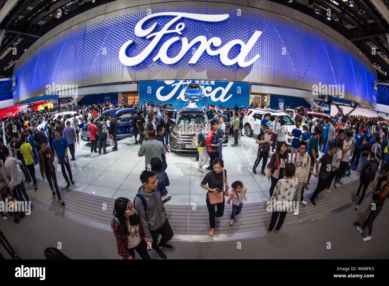 --FILE--People visit the stand of Ford during the 15th Beijing ...