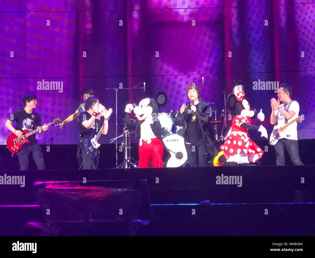 Members of Taiwanese rock band Mayday and entertainers dressed in ...