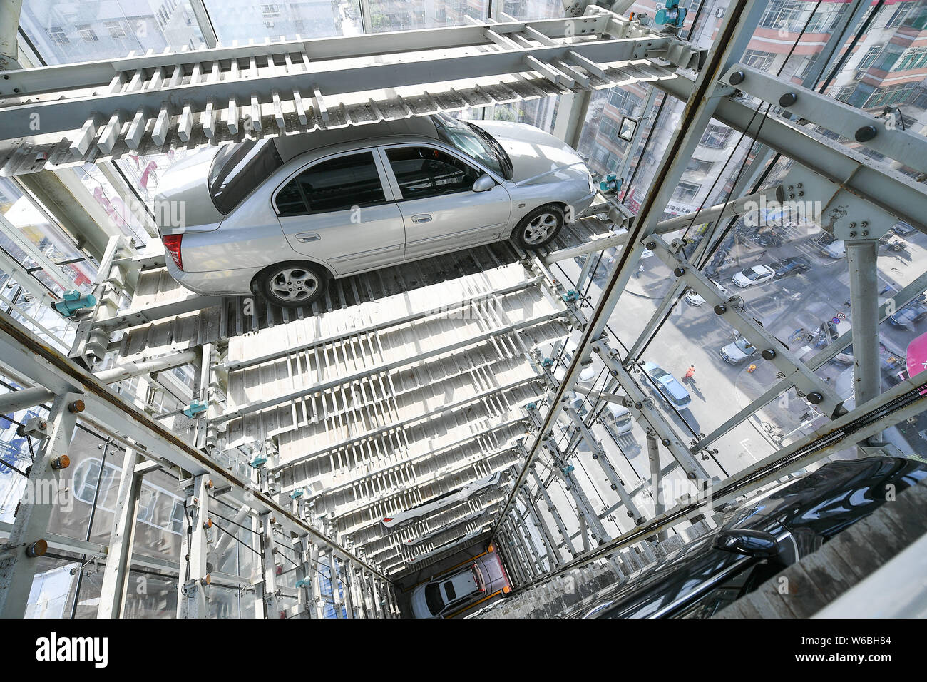 Cars are parked in a 26-storey parking garage with automated parking ...