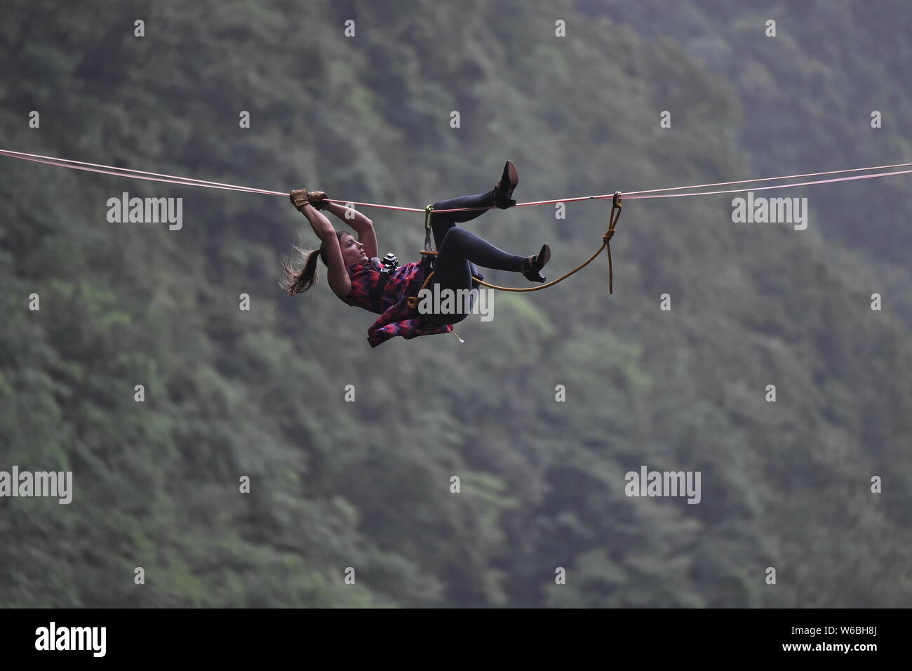 Faith Dickey of the U.S. participates in a slackline contest in high ...