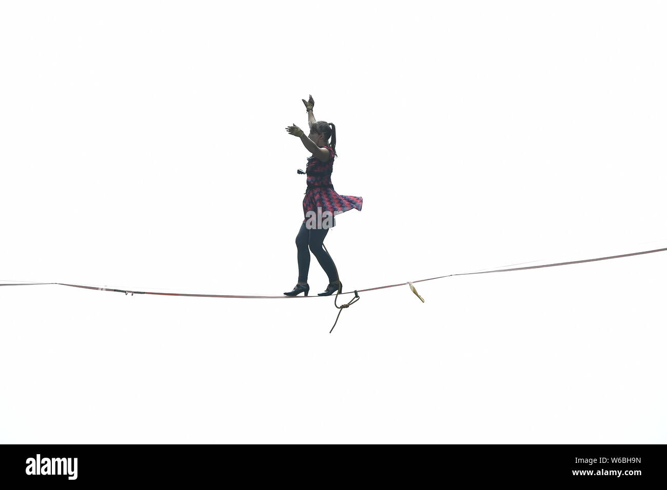 Faith Dickey of the U.S. participates in a slackline contest in high ...