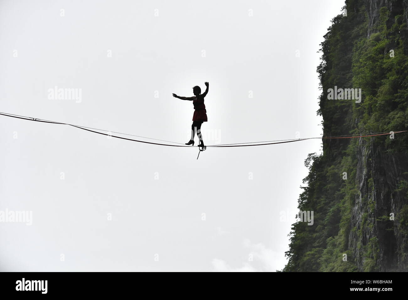Mimi Guesdon of France participates in a slackline contest in high ...