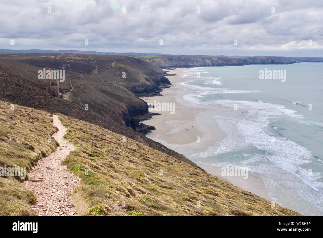 Looking West Along Chapel Porth Beach From The Cliff Top On A Spring