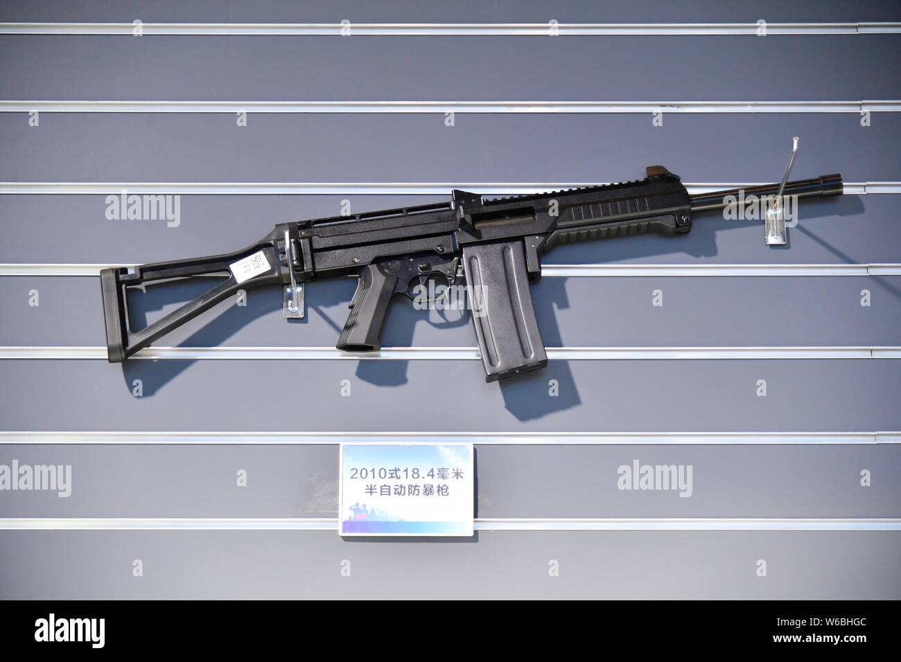 An anti-riot gun is on display during the 9th China International ...